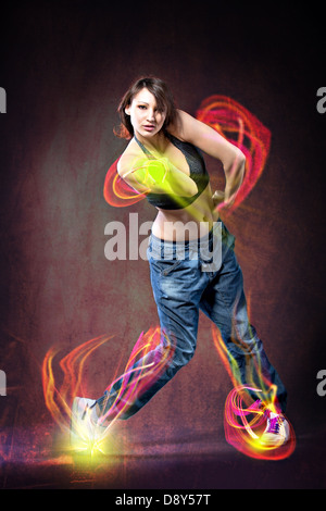 young woman in sport dress dancing zumba Stock Photo - Alamy