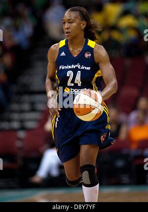 Indiana Fever forward Tamika Catchings, left, vies for possession of ...