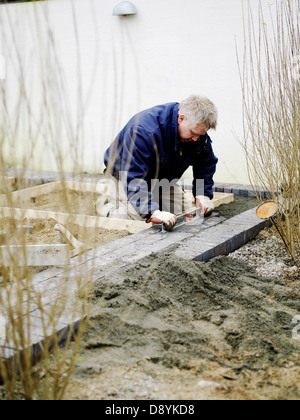 A man building a house, Sweden Stock Photo - Alamy