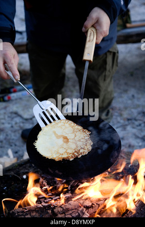 Cooking pancakes over open fire outdoors Stock Photo - Alamy