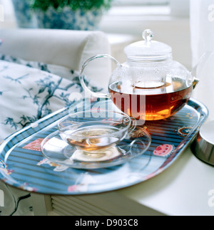 Relaxing by cup of tea Stock Photo - Alamy