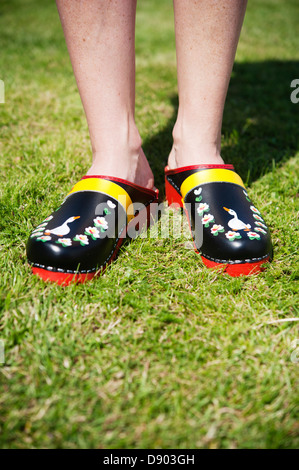 Person wearing clogs, close-up Stock Photo - Alamy