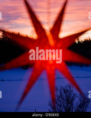 An Advent star in a window Stock Photo - Alamy