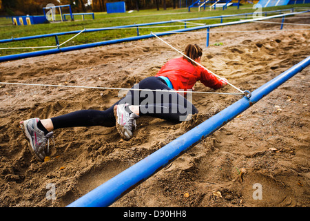 Woman crawling on ground Stock Photo - Alamy