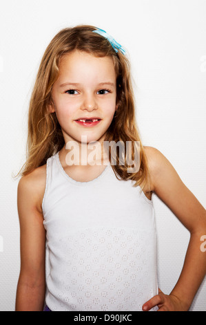 Small happy girl in white dress enjoying sunny day at the beach. Shoot ...