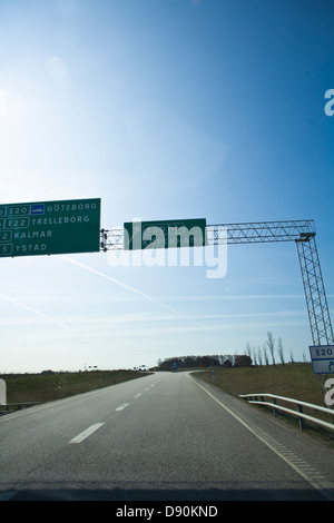 Road signs over motorway Stock Photo - Alamy