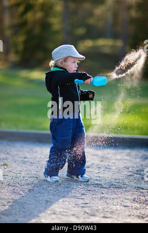 boy throwing sand Stock Photo - Alamy