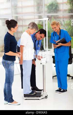 Nurse Measuring Height Stock Photo - Alamy