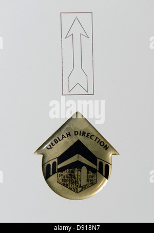 A Qibla arrow sign for a Muslim prayer direction Stock Photo - Alamy