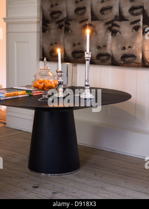Candles on round table in modern kitchen Stock Photo - Alamy