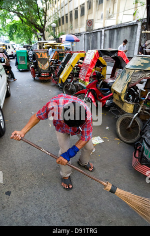 Road Sweeper in Manila, Philippines Stock Photo - Alamy