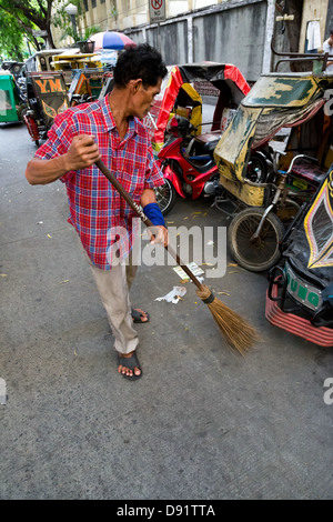 Road Sweeper in Manila, Philippines Stock Photo - Alamy