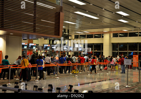 People wait at Jetstar check in counter Sydney Airport in Sydney ...