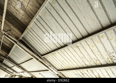 A industrial garage ceiling with open gates Stock Photo - Alamy