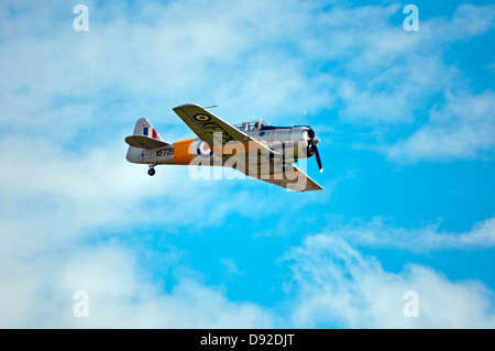 Harvard Mk4 fighter aircraft flying against clouds and blue sky Stock ...