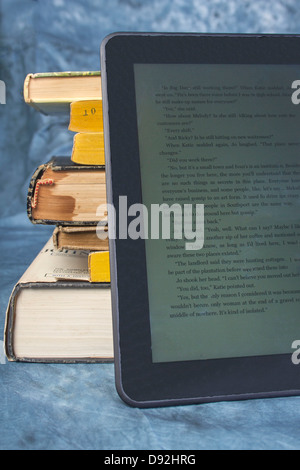A black e-reader device with a keyboard and a blank screen, designed ...