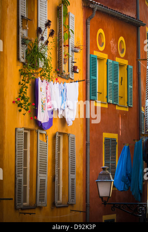 Nice, France, colorful facade, with typical windows and shutters, in a ...