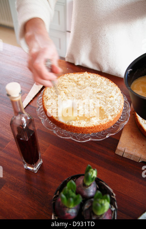 Woman preparing sponge cake Stock Photo - Alamy