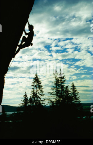 Person climbing rock, side view Stock Photo - Alamy