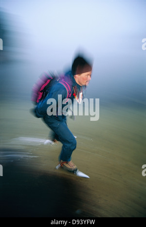 Man long-distance skating Stock Photo - Alamy