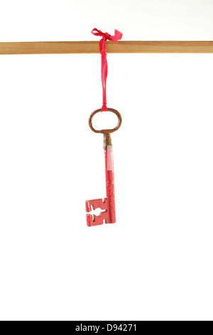 Big key hanging on a string, security concept Stock Photo - Alamy