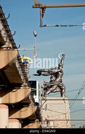 Statue of a Worker and Kolkhoz Woman on top of the main entrance at the ...