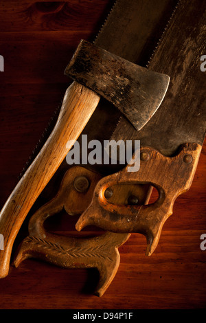 Still life of old hatchet and hand saws Stock Photo - Alamy