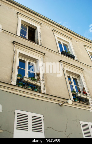 Windows, blue window frames and blue shutters, with decorative film as ...