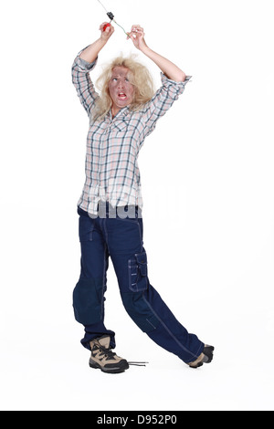 A woman being electrocuted Stock Photo - Alamy