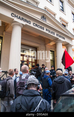 Protesters gather in Soho Square wearing face masks of American ...