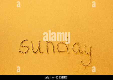 Sunday - written in sand on beach texture - soft wave of the sea (days ...