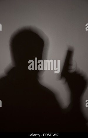 Shadow of the man with gun Stock Photo - Alamy