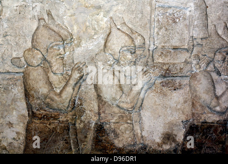 Assyrian wall-panel depicting an attack on an enemy town. Dated ...