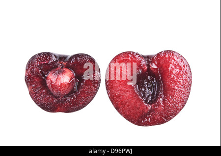 fresh cherry cut in halves isolated on white Stock Photo - Alamy