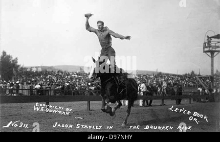 Cowboy Jason Stanley performing a riding trick at the Round-Up ...