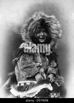 A photograph of an Eskimo child wearing traditional clothing at Point ...