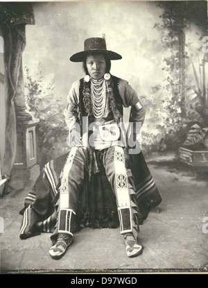 Portraits of a Nez Perce Indian wearing a war bonnet, shown in various ...