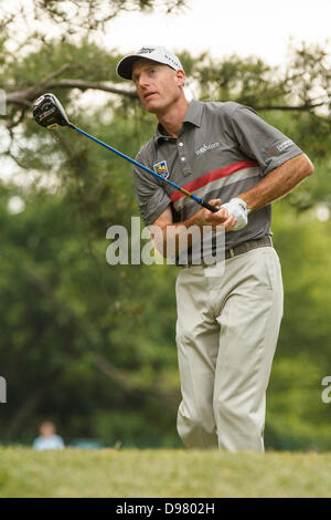Jim Furyk of the US hits a tee shot off the first tee during a practice ...