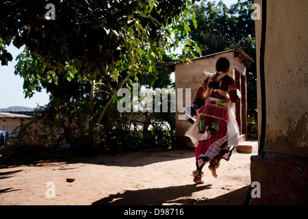 During sangoma initiation ceremony girls chant dance in hut in Peernars ...
