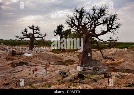 A clam-shell island, linked to Fadiouth in Senegal by a bridge is home ...