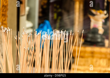 Burning essence sticks outside temple Stock Photo - Alamy