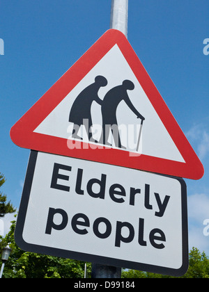 Warning sign with elderly people symbol Stock Photo - Alamy
