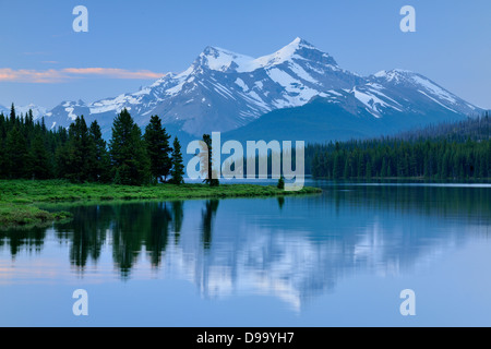 Mt Charlton and Mt Unwin reflected in Maligne Lake at dawn Jasper ...