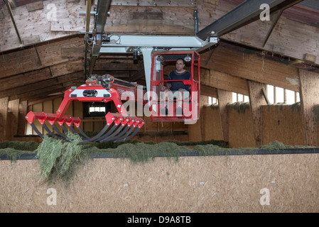 Overhead ceiling mounted crane for storage and retrivial of hay, straw ...