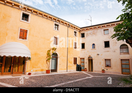 Courtyard of guesthouse, Fumane, Italy Stock Photo - Alamy