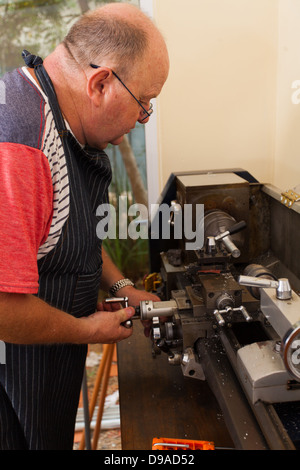 mechanic using industrial lathe machine Stock Photo - Alamy