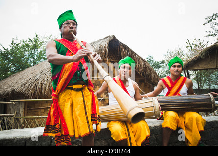 Tribal men playing musical instruments during Karma Puja festival ...