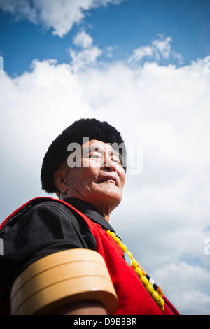 An Angami Naga man in his cultural attires during Sekrenyi Festival at ...
