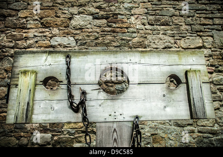 Detail of wooden medieval stocks used to incarcerate criminals in ...