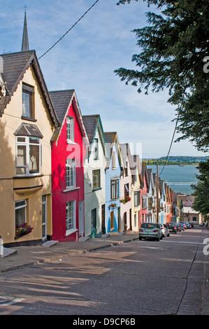 Row houses in Cobh, Ireland up the hill to St ColmanÕs Cathedral Stock ...